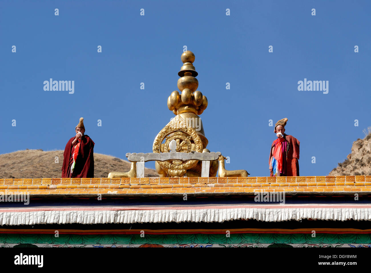 Tibetan monks wearing robes and yellow hats of the Gelug Order or ...