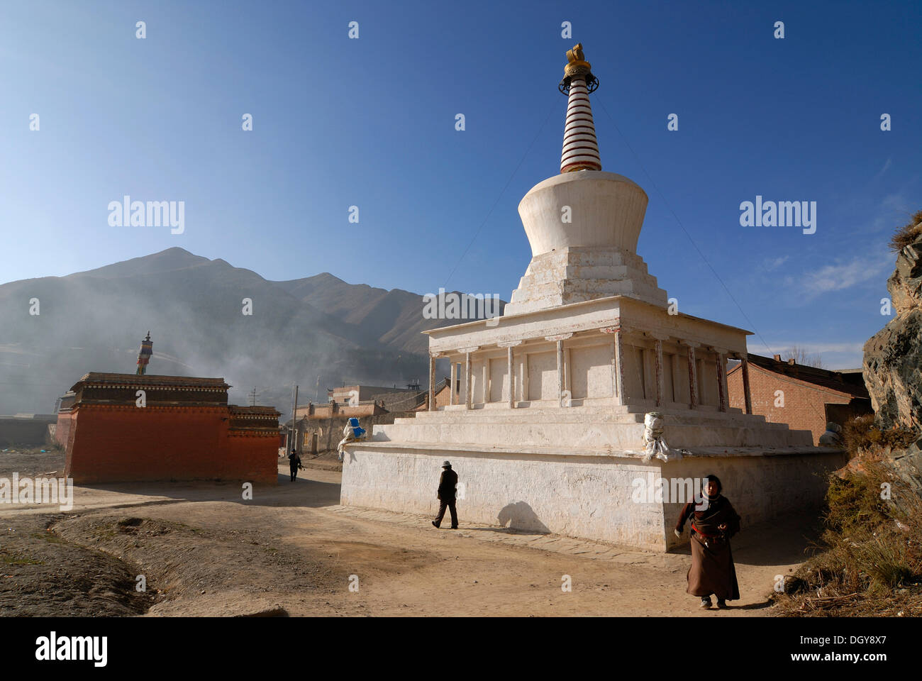 Two Tibetan women circling a stupa of the Labrang monastery, Xiahe ...