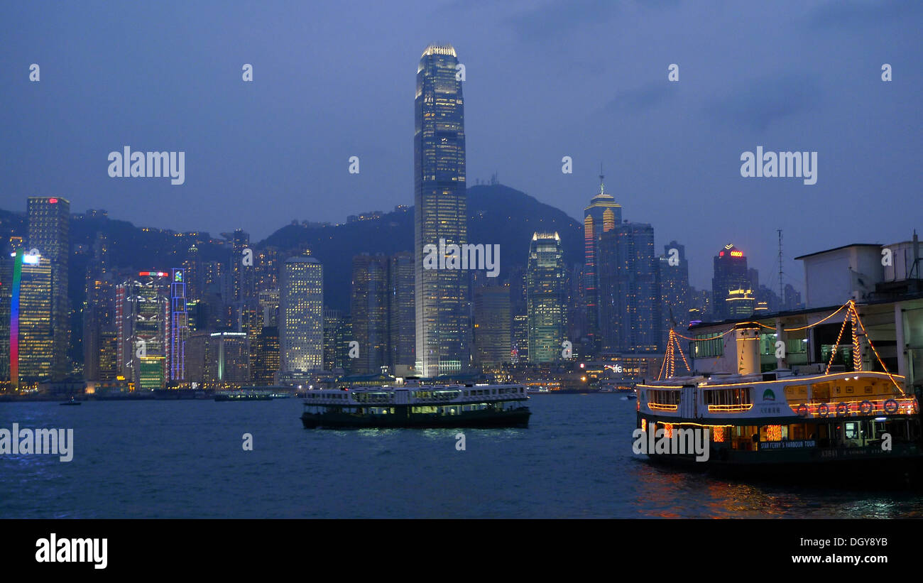 Nightly illuminated Hong Kong with skyscrapers, high-rise buildings and ...