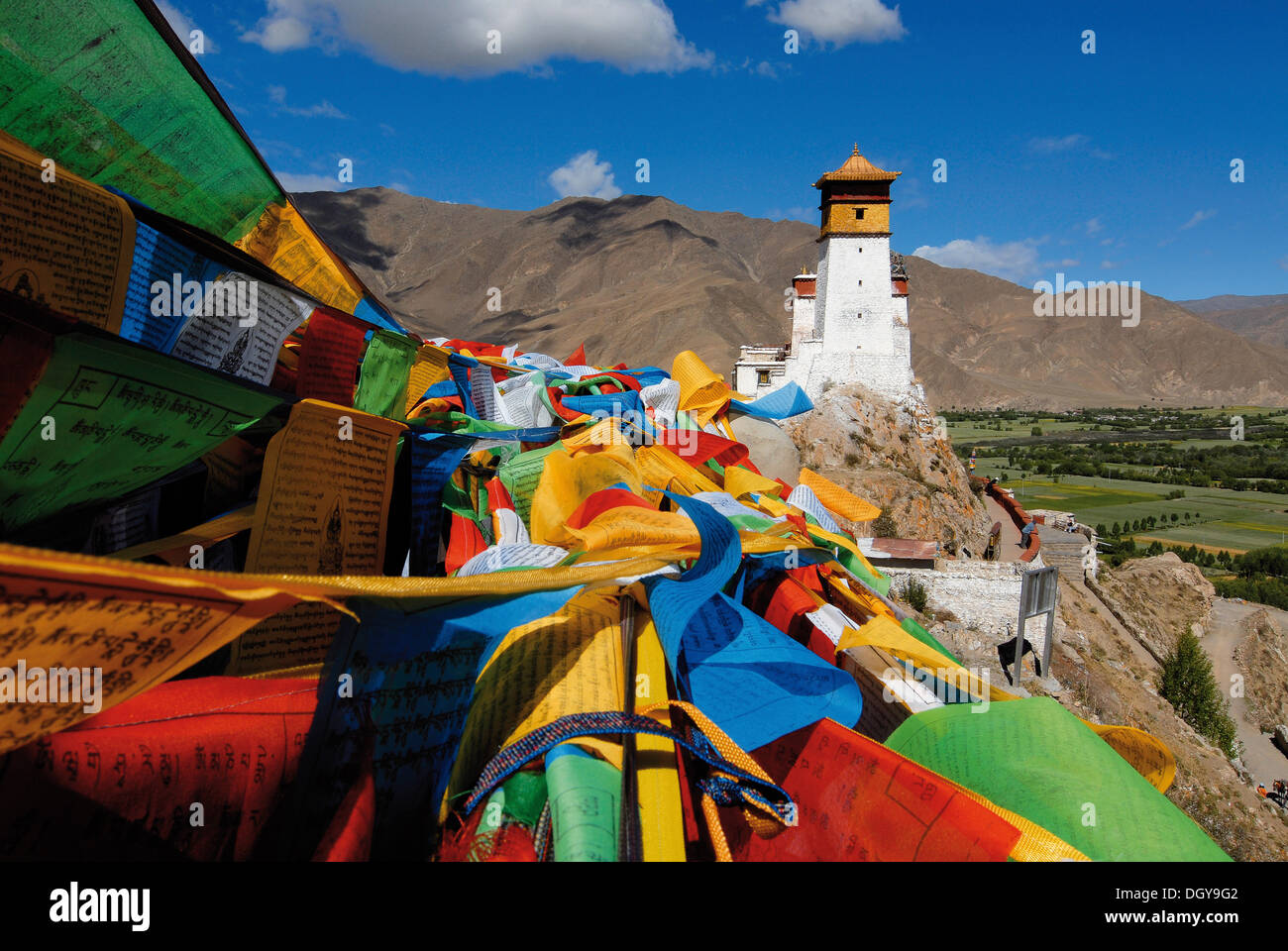 Prayer flags flying above the Yarlung valley on Yumbulagang Palace ...