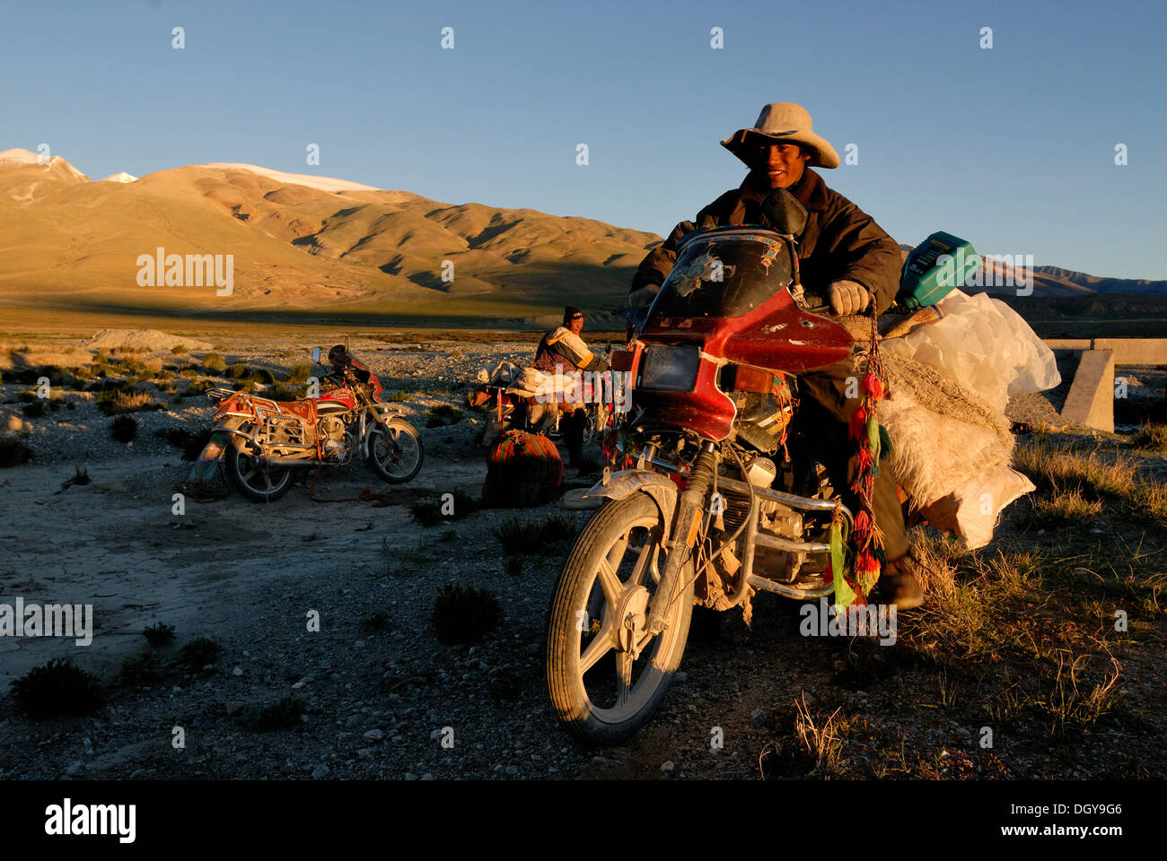 Tibetan pilgrims with decorated and packed bikes on their way to Mount ...