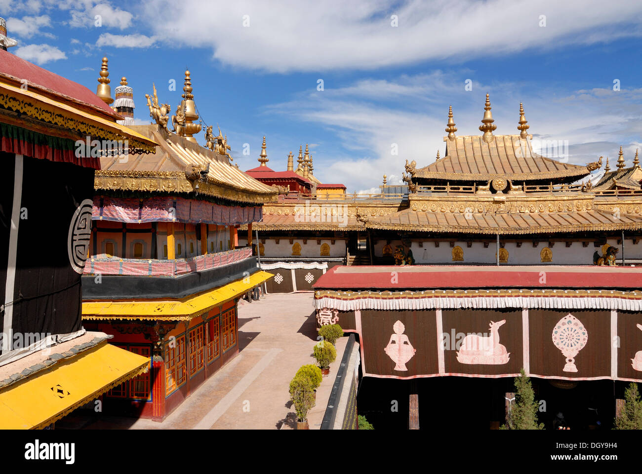 Courtyard with gilded roofs of the Jokhang Temple, Lhasa, Tibet, China ...