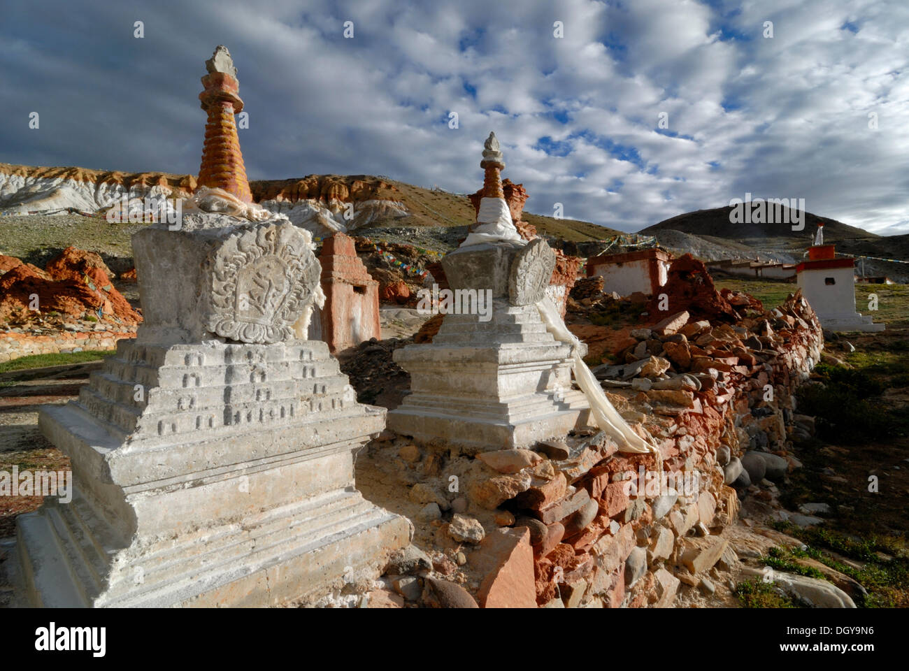 Tibetan Mani stones and yak horn in front of chorten and stupas at the ...