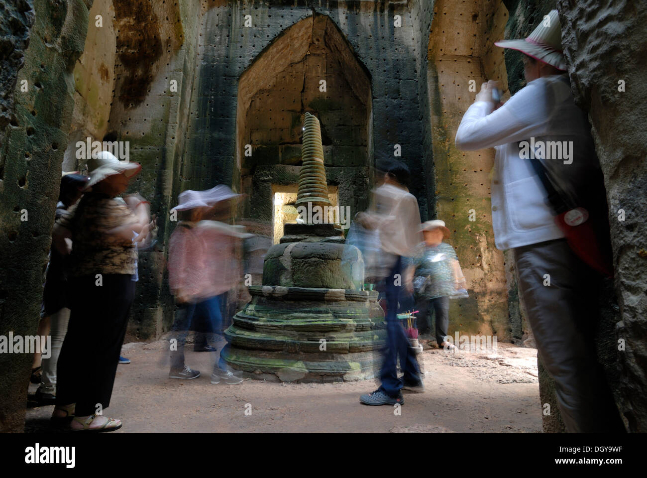 Tourists visit the stupa of Preah Khan, Angkor Wat Temple Complex, Siem ...