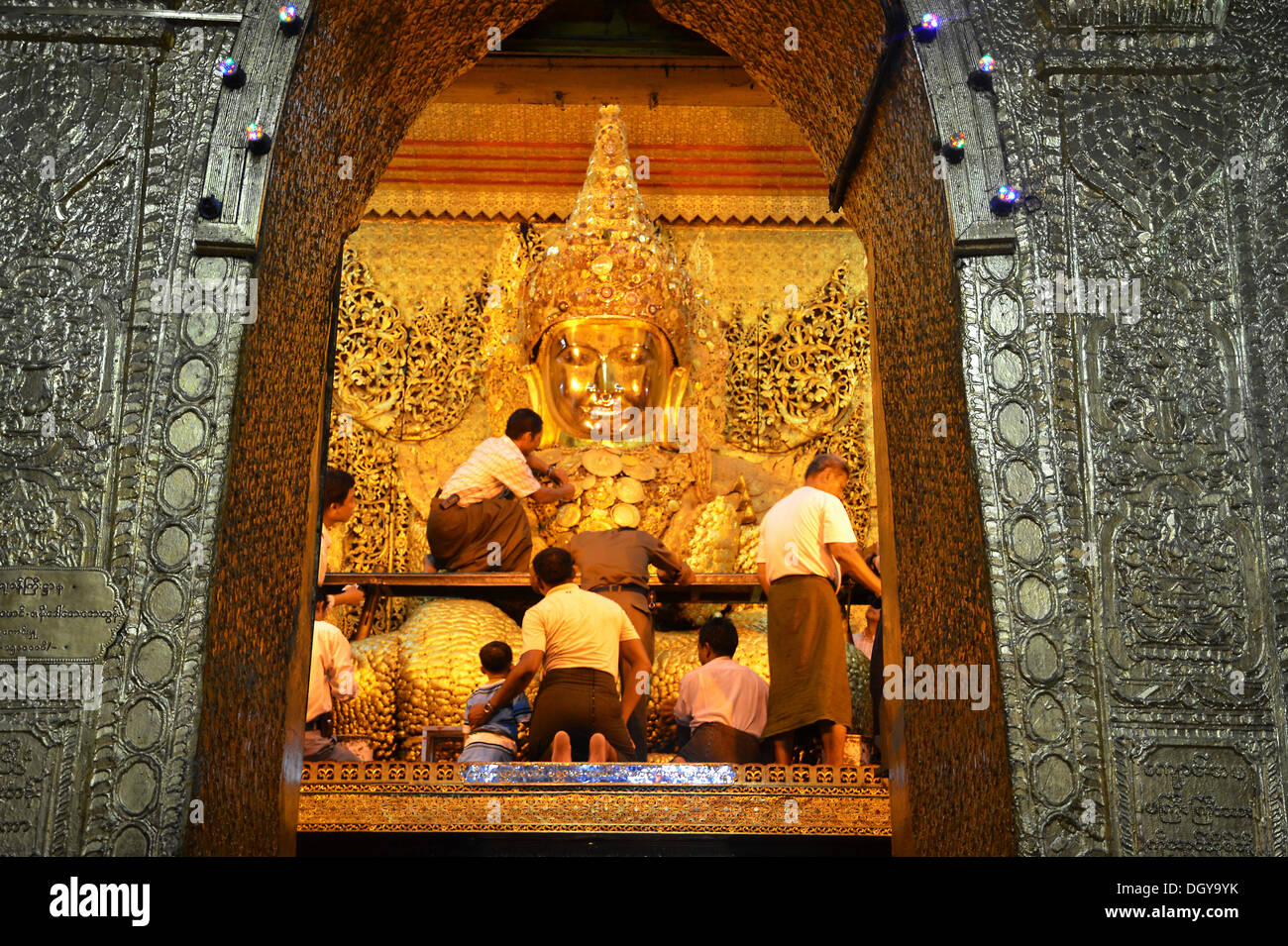Most holy Buddha of the country, golden Mahamuni Buddha, being covered ...