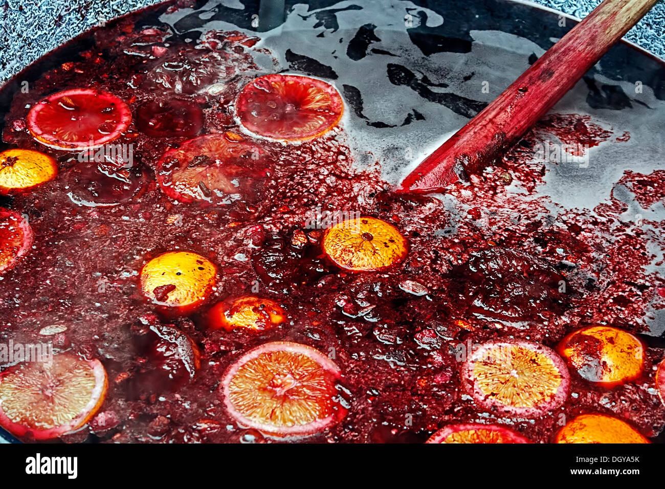 Red wine with orange and lemon pieces, boil in a large bowl and mix ...