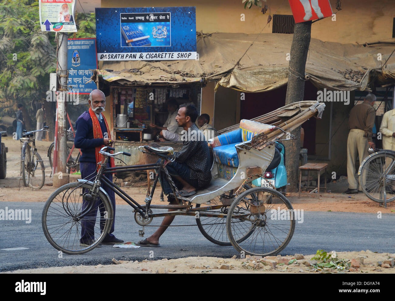 Street scene, two Indian men with bicycle rickshaws, Sarnath, Varanasi ...