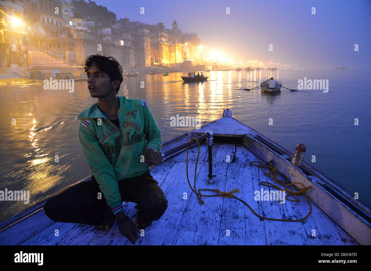 Indian boatman on the Ganges near the ghats at dawn, Ganges, Varanasi ...