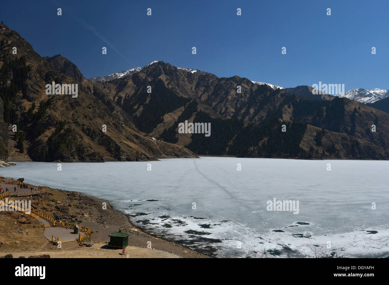 Frozen mountain lake of Tian Chi, with the Peak of God, 5445m, Bogeda ...