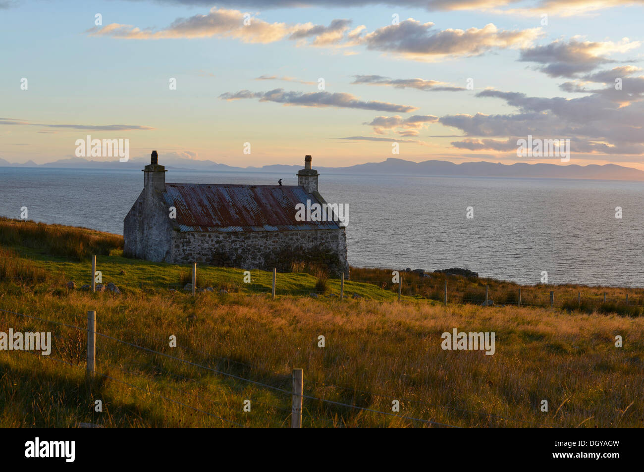 Evening view on the Isle of Skye on a single track road with an old ...