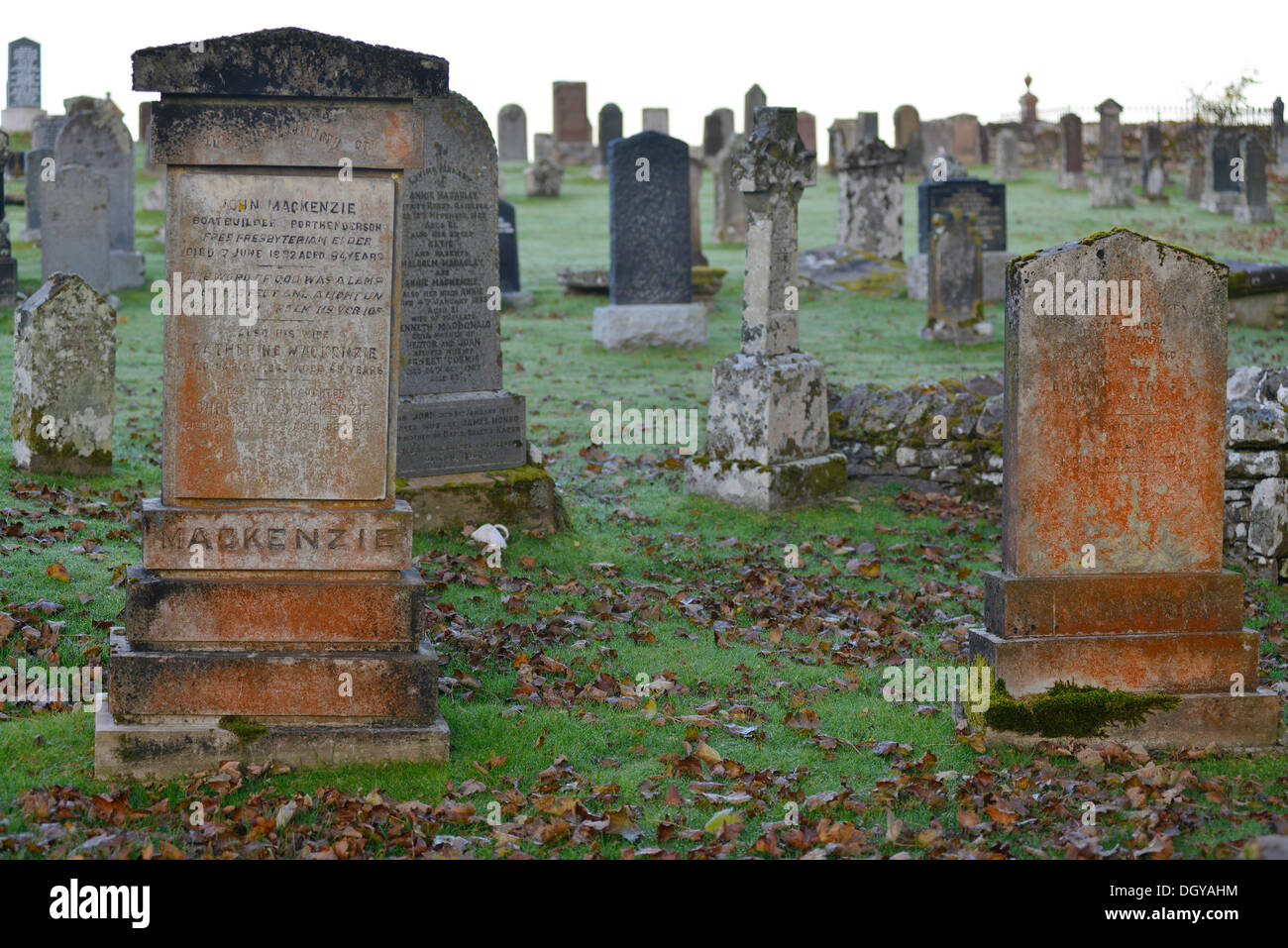 Old Scottish graveyard with Celtic crosses and gravestones with ...