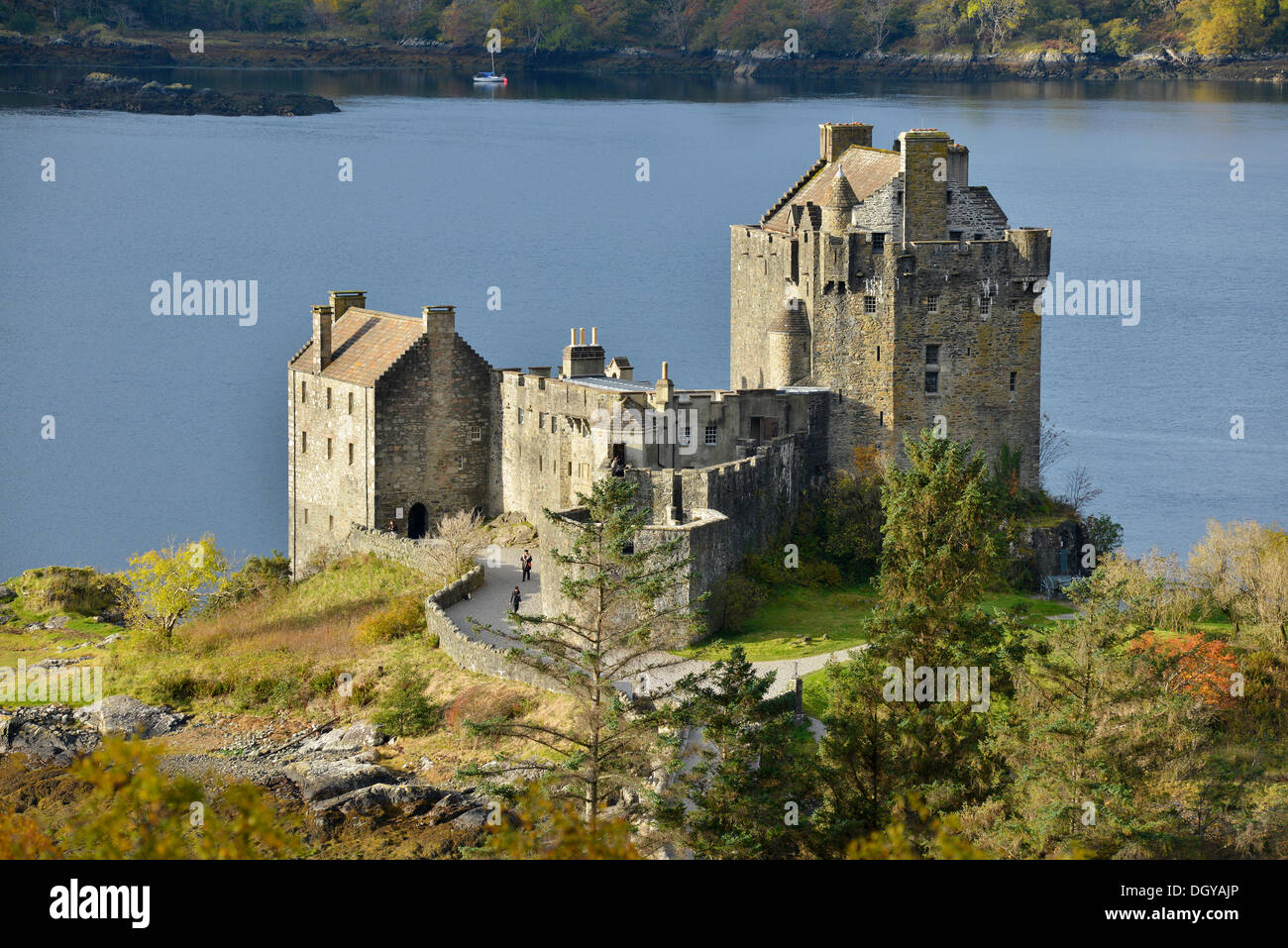 Eilean Donan Castle with autumnal forest, headquarters of the Scottish ...