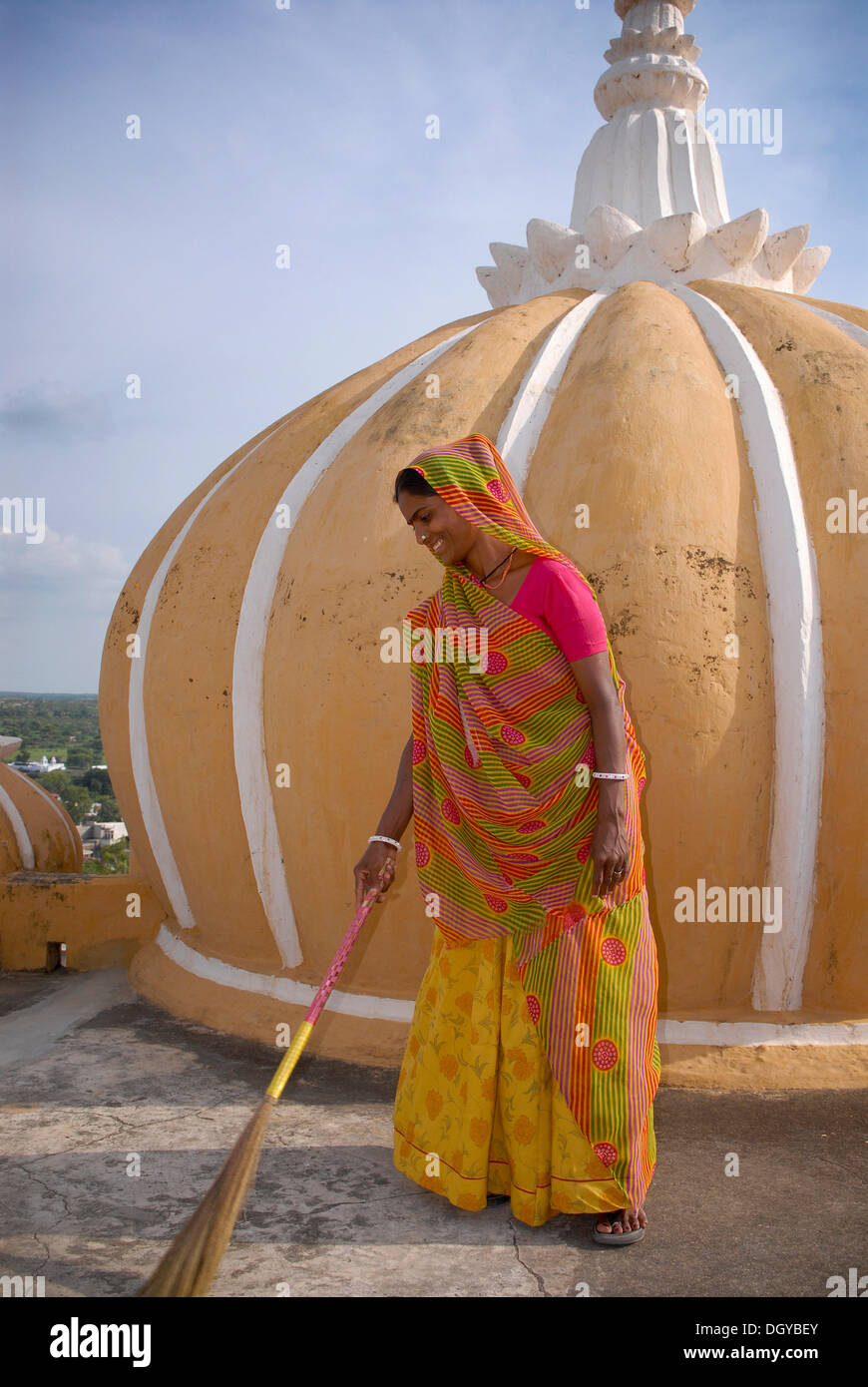 Indian woman sweeping the roof of the Deogarh Palace Hotel, Rajasthan ...