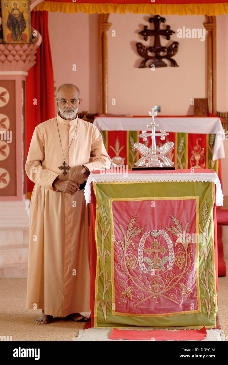 Catholic priest in front of the cross of the St. Thomas Christians, Mar ...