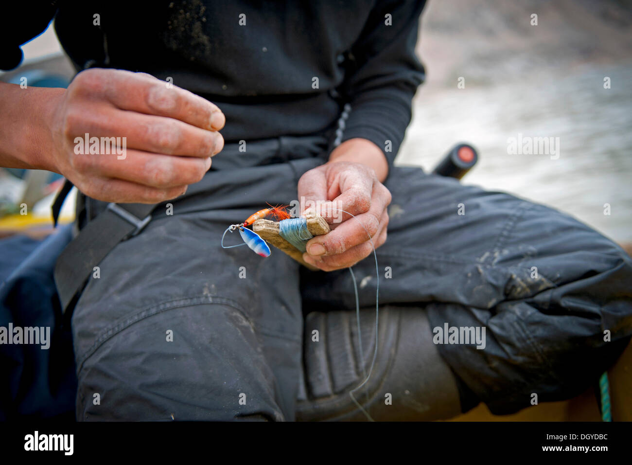 Hands of an Inuit hunter in the Inuit settlement of Tiniteqilaaq ...