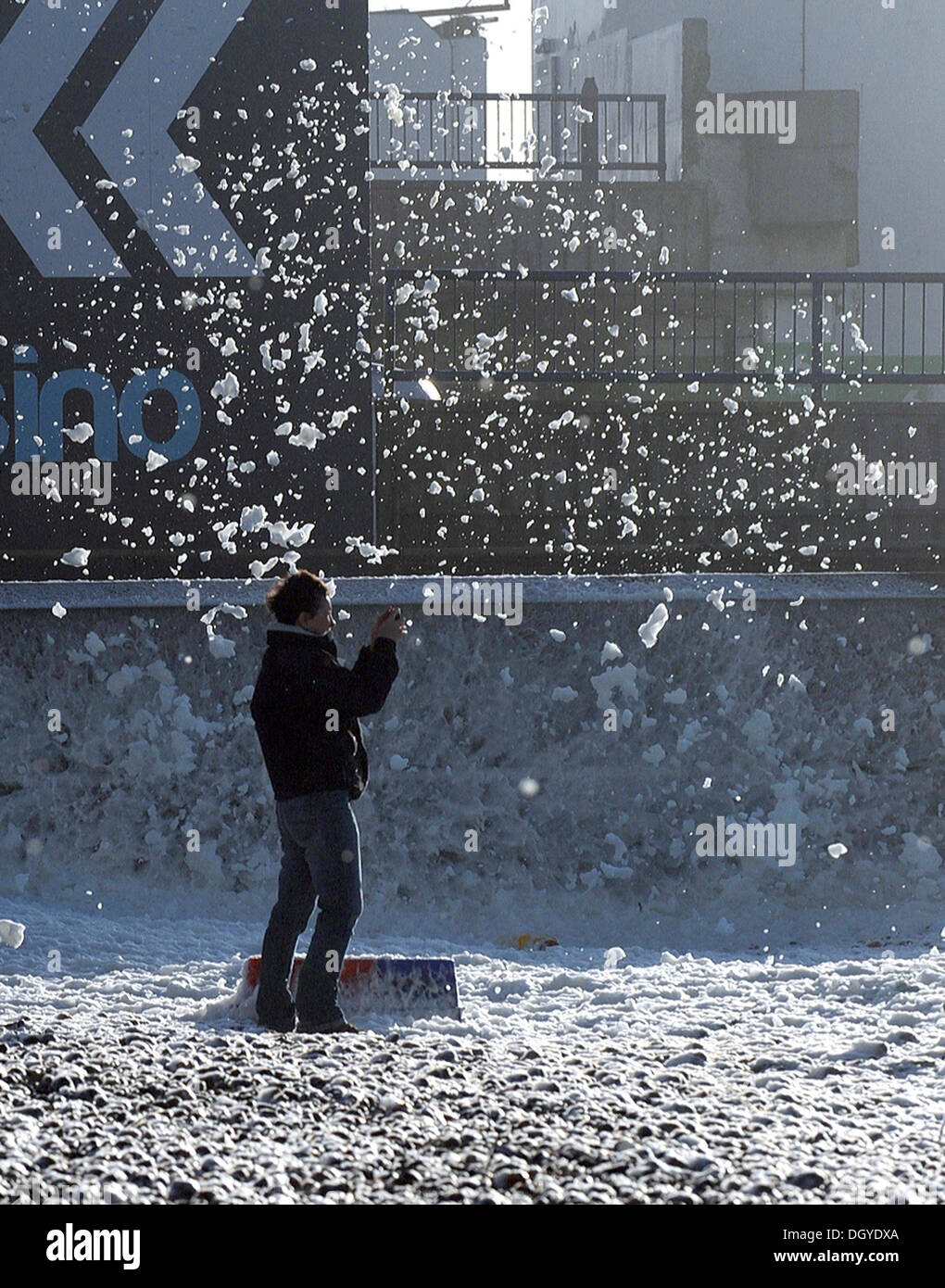 The high winds whip up the sea into a snow like froth on Brighton beach ...