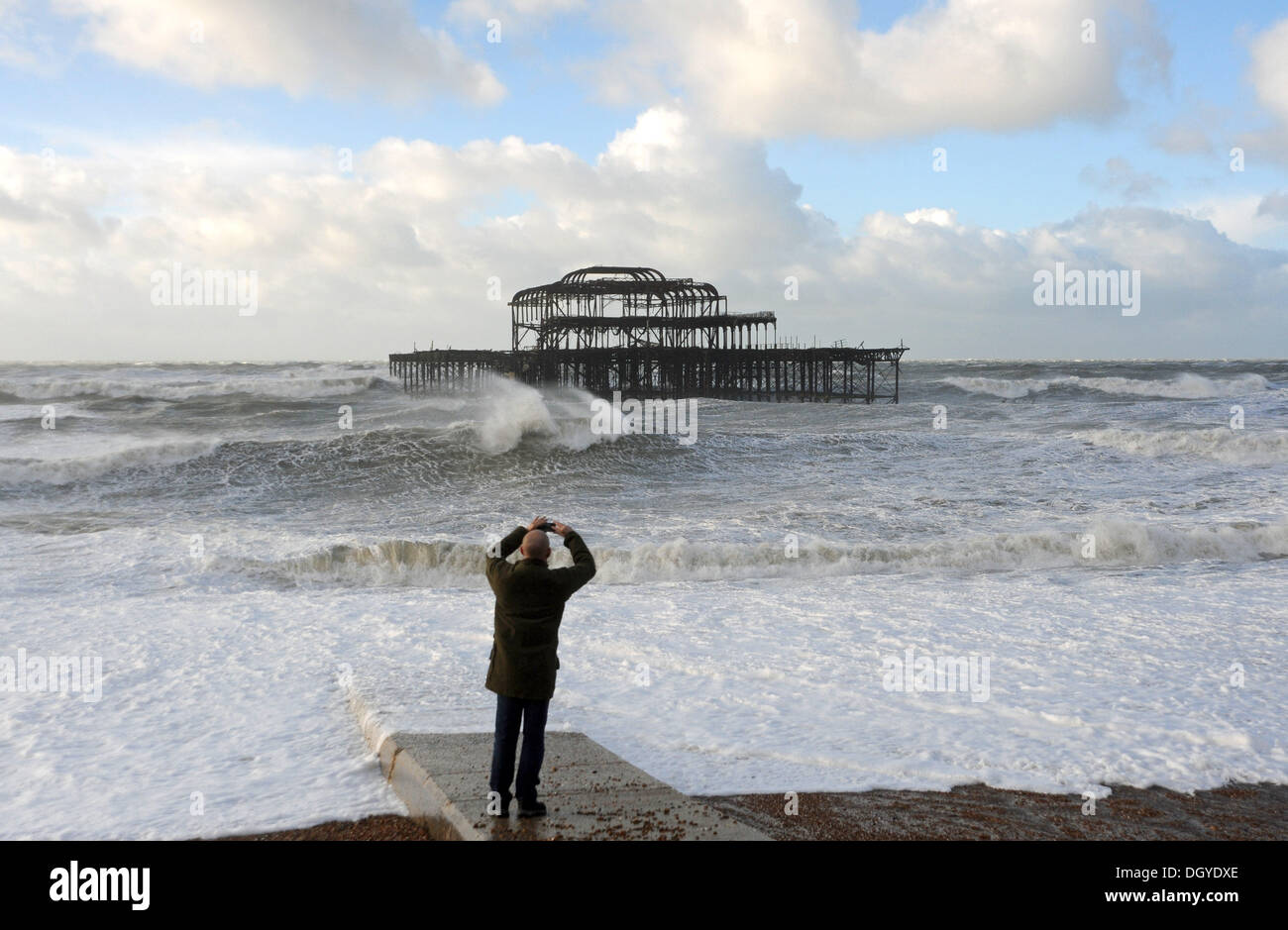 A man photographs the West Pier Brighton as storms battered the south ...