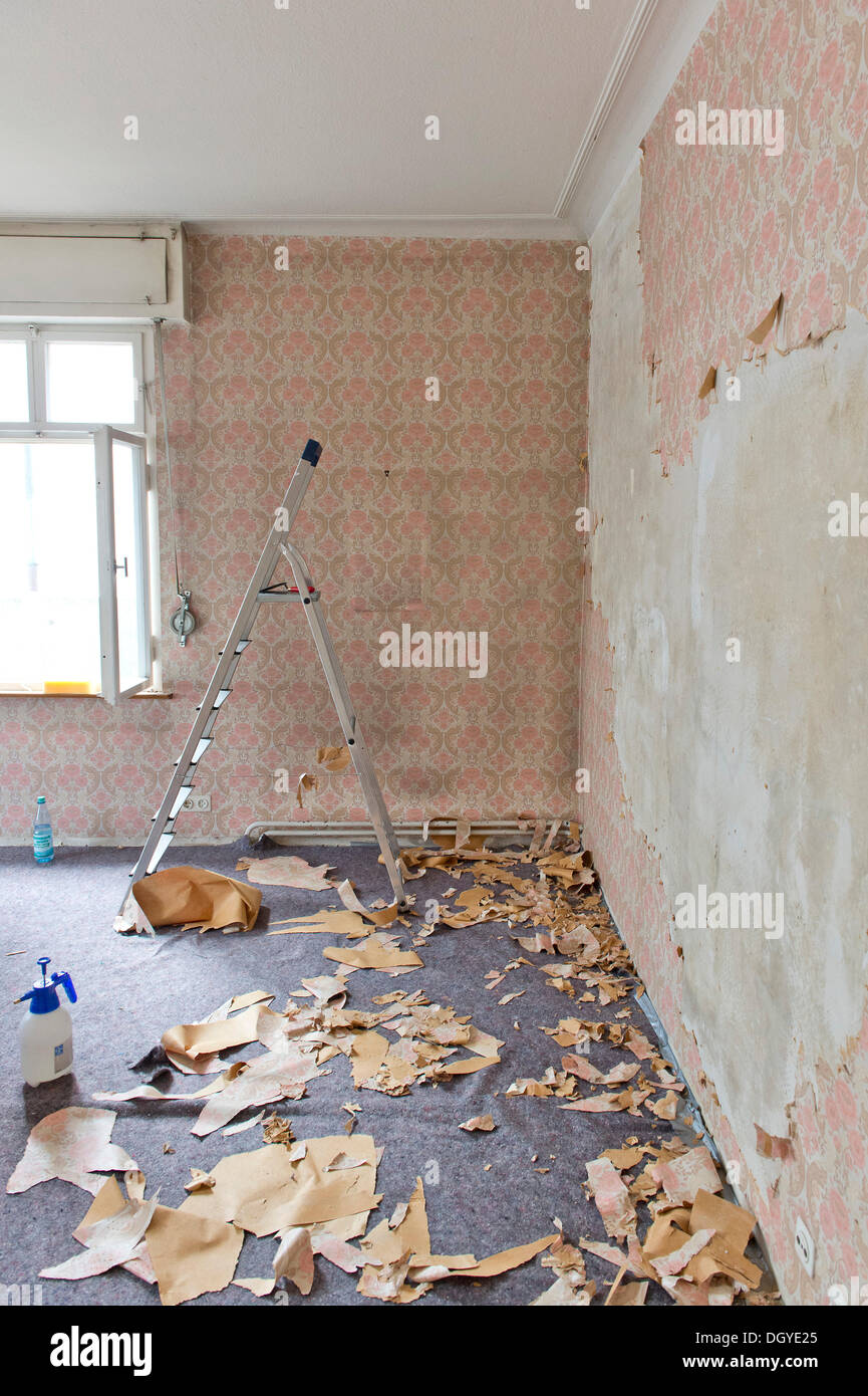 Room in an old building being renovated, old wallpaper from the sixties ...
