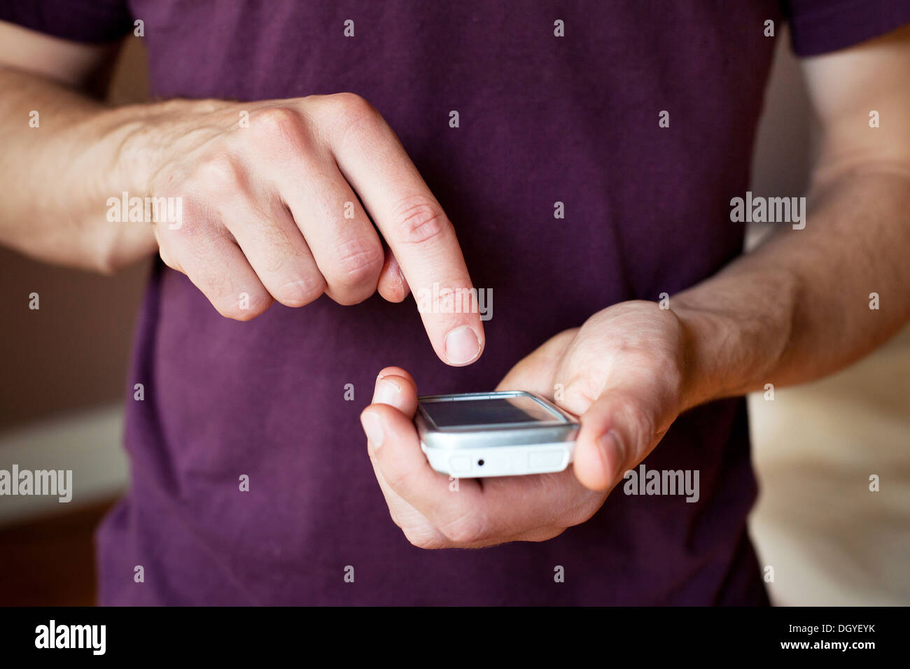 Business man touching smartphone hi-res stock photography and images ...