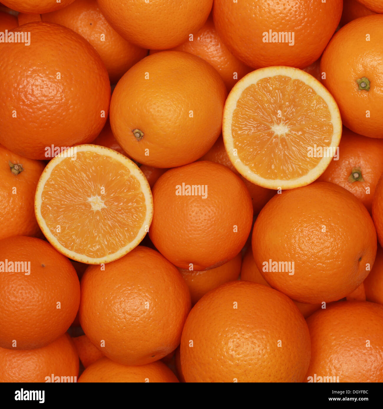 Orange background decorated with two fresh sliced oranges Stock Photo ...