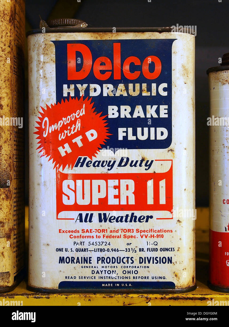 This image features an old Delco brake fluid can, a vintage product ...