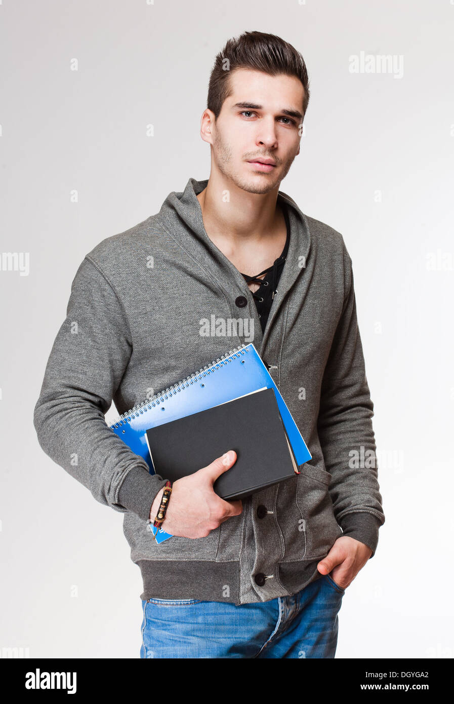 A young student with learn with books hi-res stock photography and ...