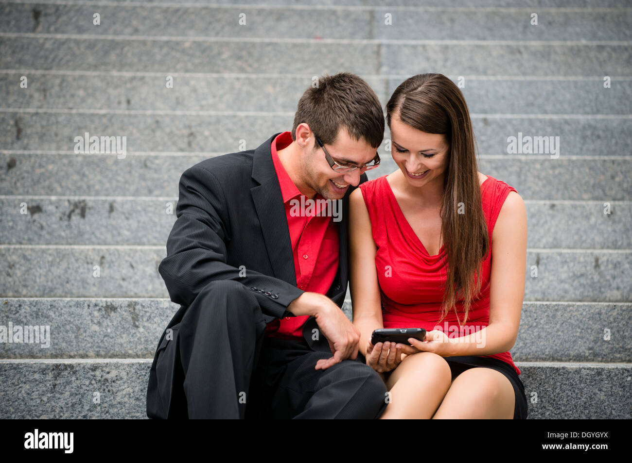 Two people sitting on stairs hi-res stock photography and images - Alamy