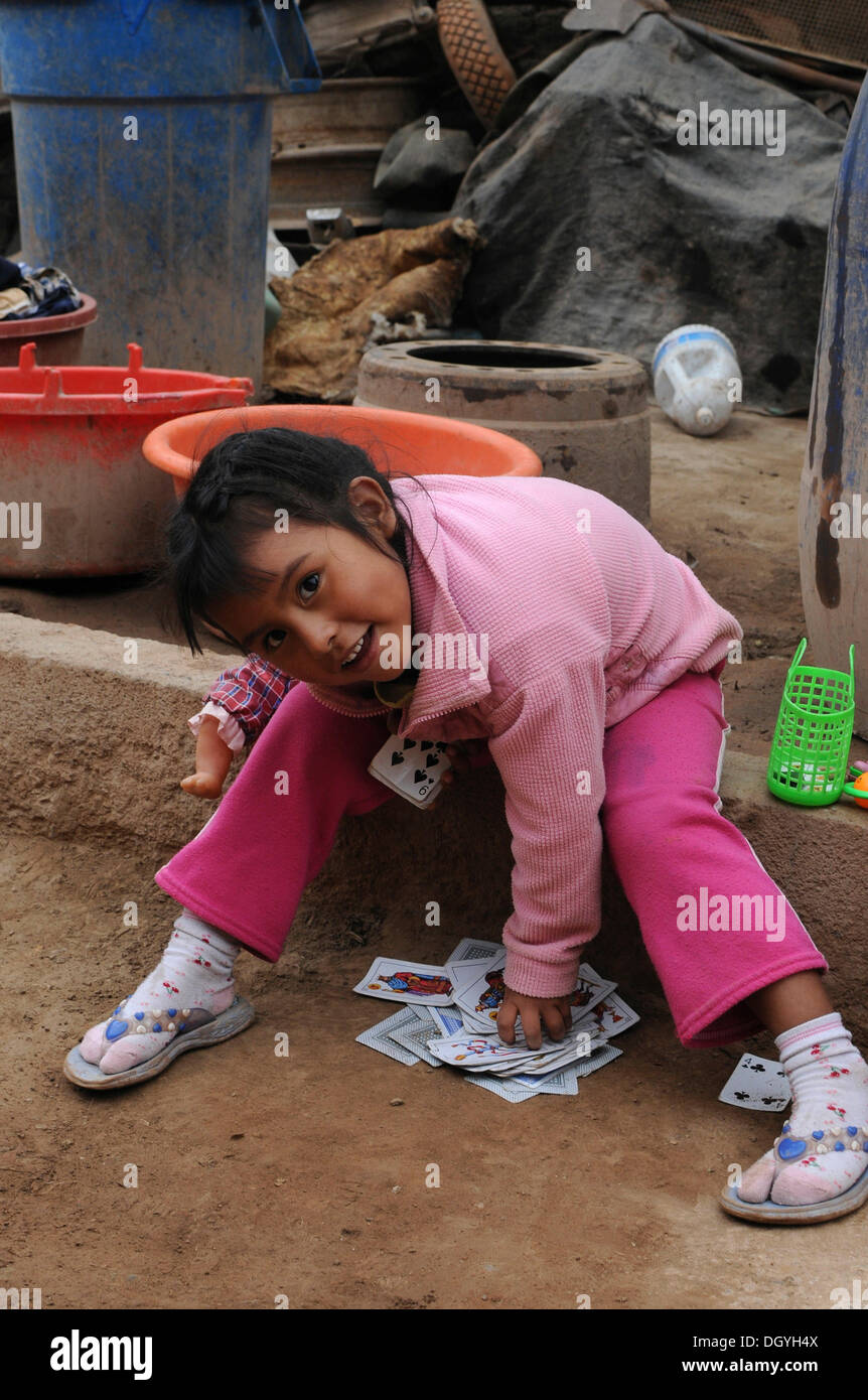 Little girl playing with cards, Nazca, Inca settlement, Quechua ...