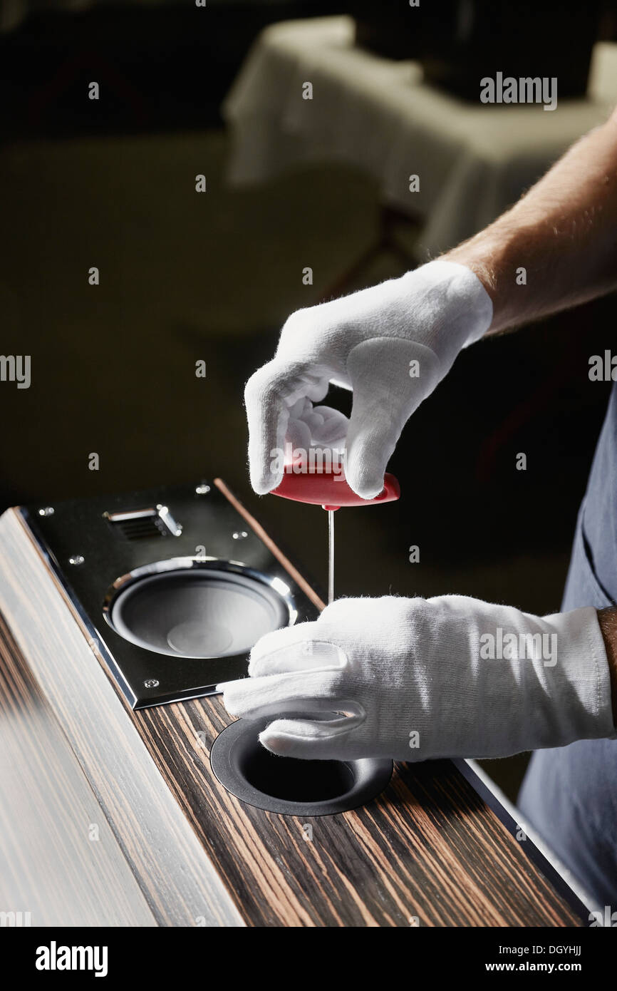 A repairman working an audio speaker Stock Photo - Alamy