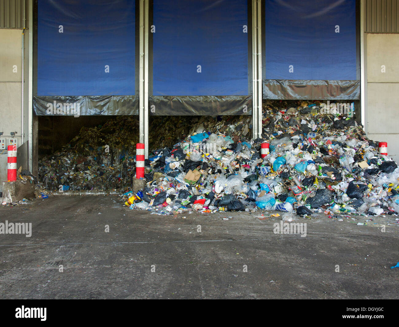 Household waste dump at recycling plant. From this buffer area the ...