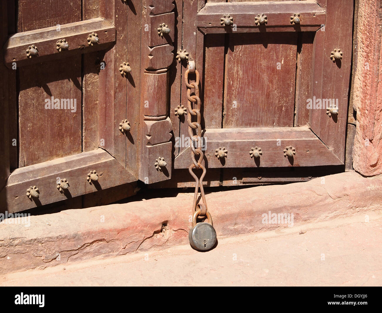 Old rusty padlock and chain on the rural wooden gate Stock Photo - Alamy