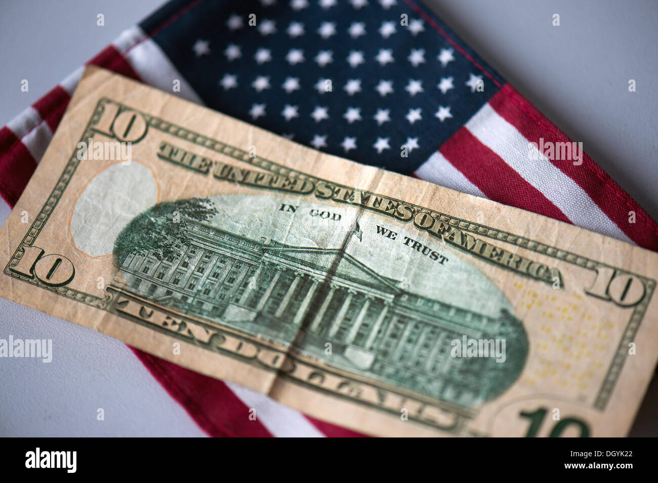 ILLUSTRATION - A Ten-dollar banknote lies on an American flag in ...