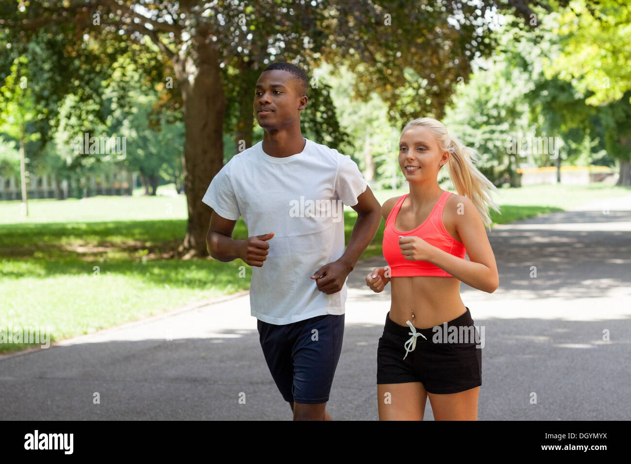 young couple runner jogger in park outdoor summer sport lifestyle Stock ...