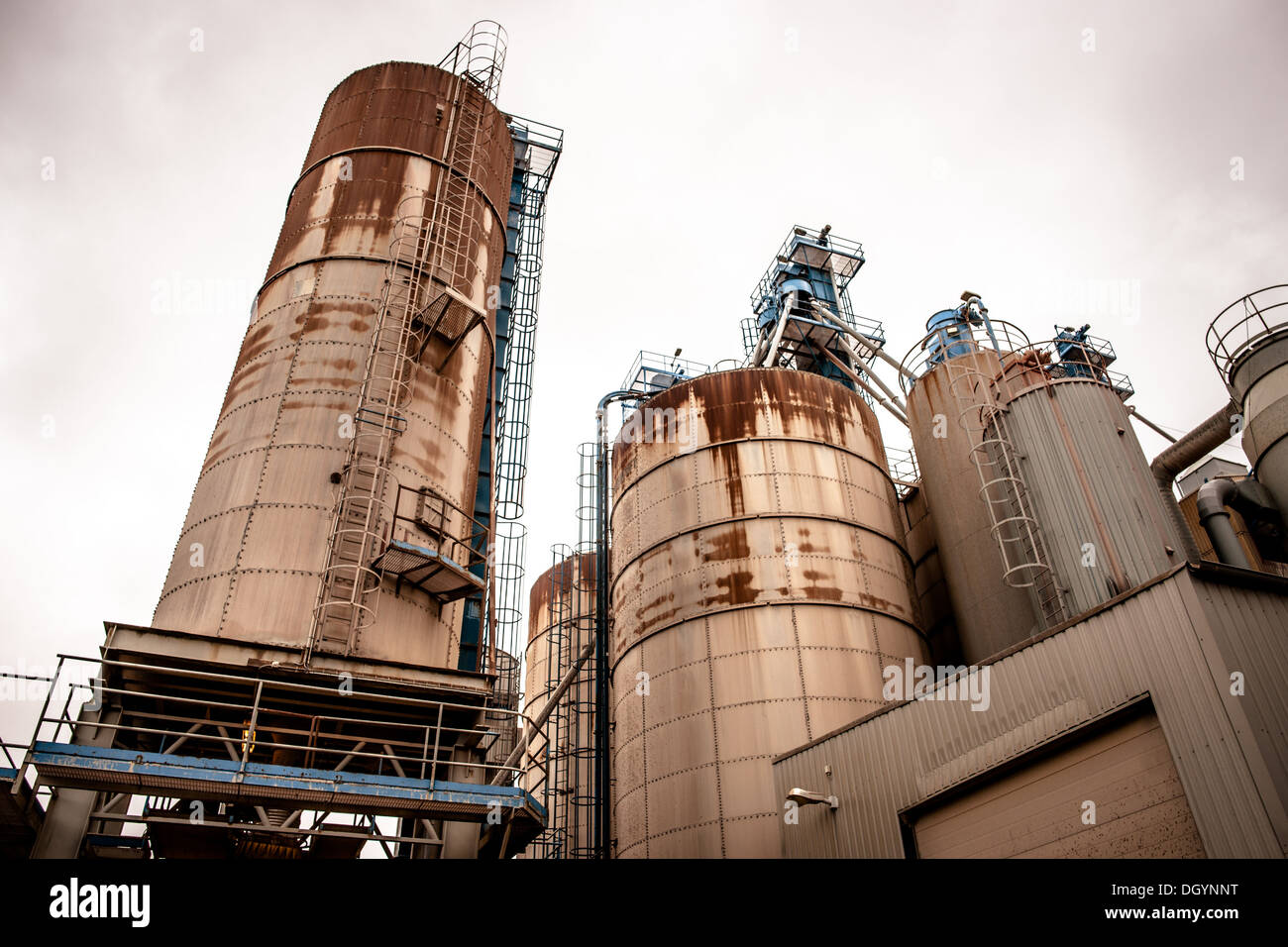 Industrial silos in a old rusty inviroment Stock Photo - Alamy