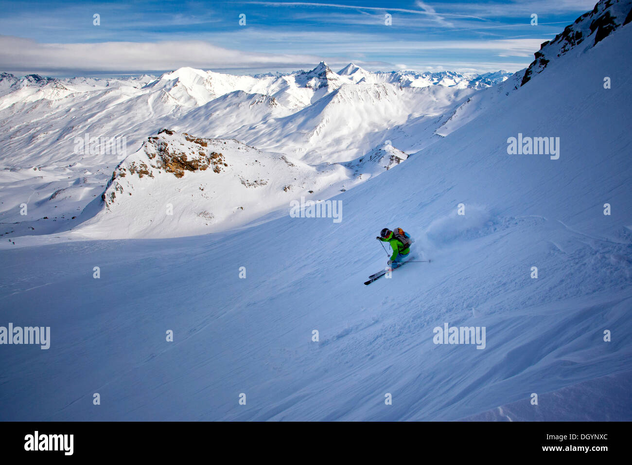 Skiers descending steep slopes hi-res stock photography and images - Alamy