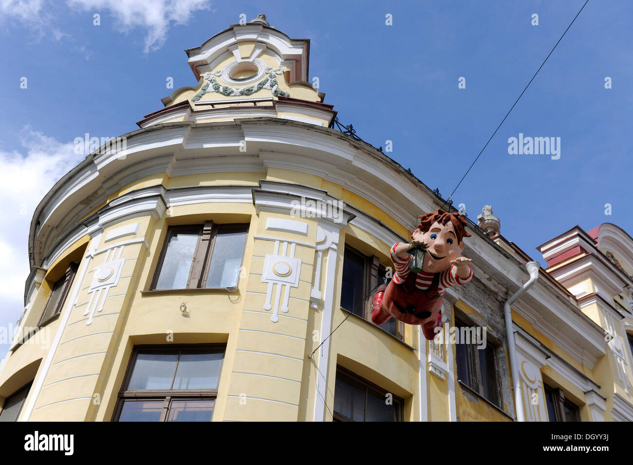 Comical figure with lantern, decoration on a building facade, Tallinn ...