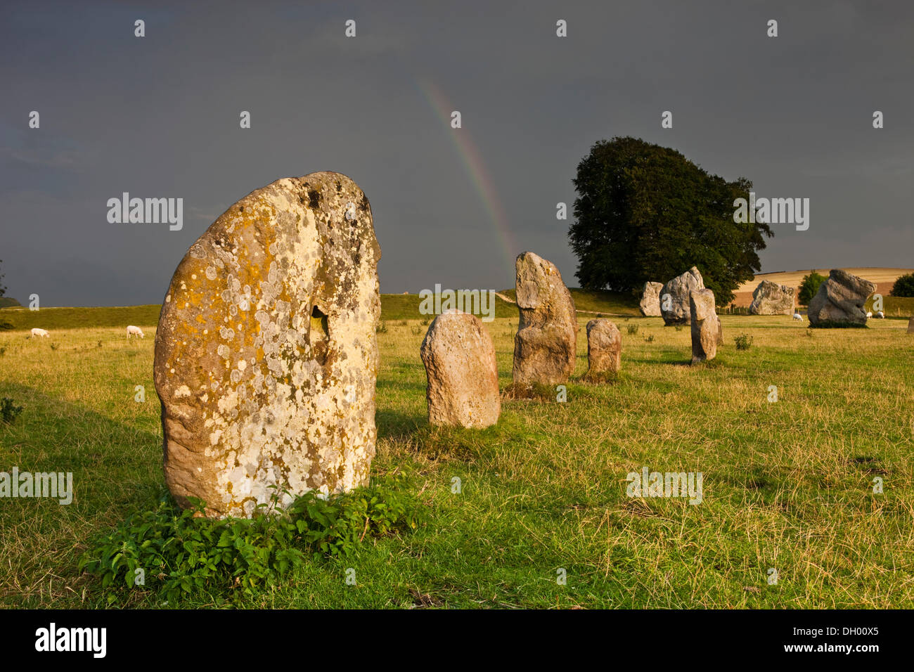 Rainbow over a ring of standing stones, stone circle, Avebury ...