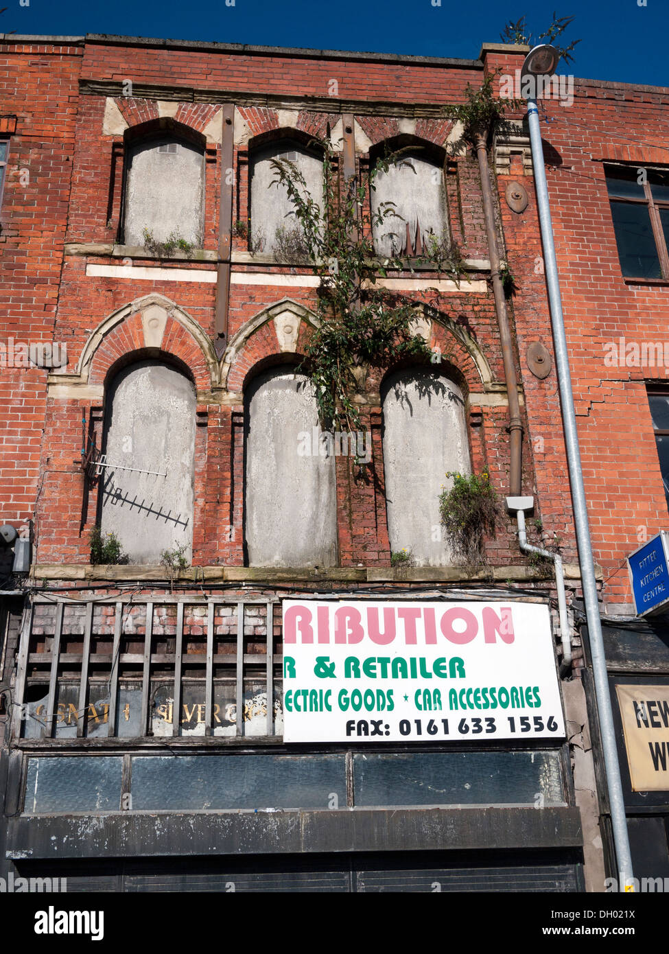 Old rundown building with plants growing in the brickwork, Oldham ...