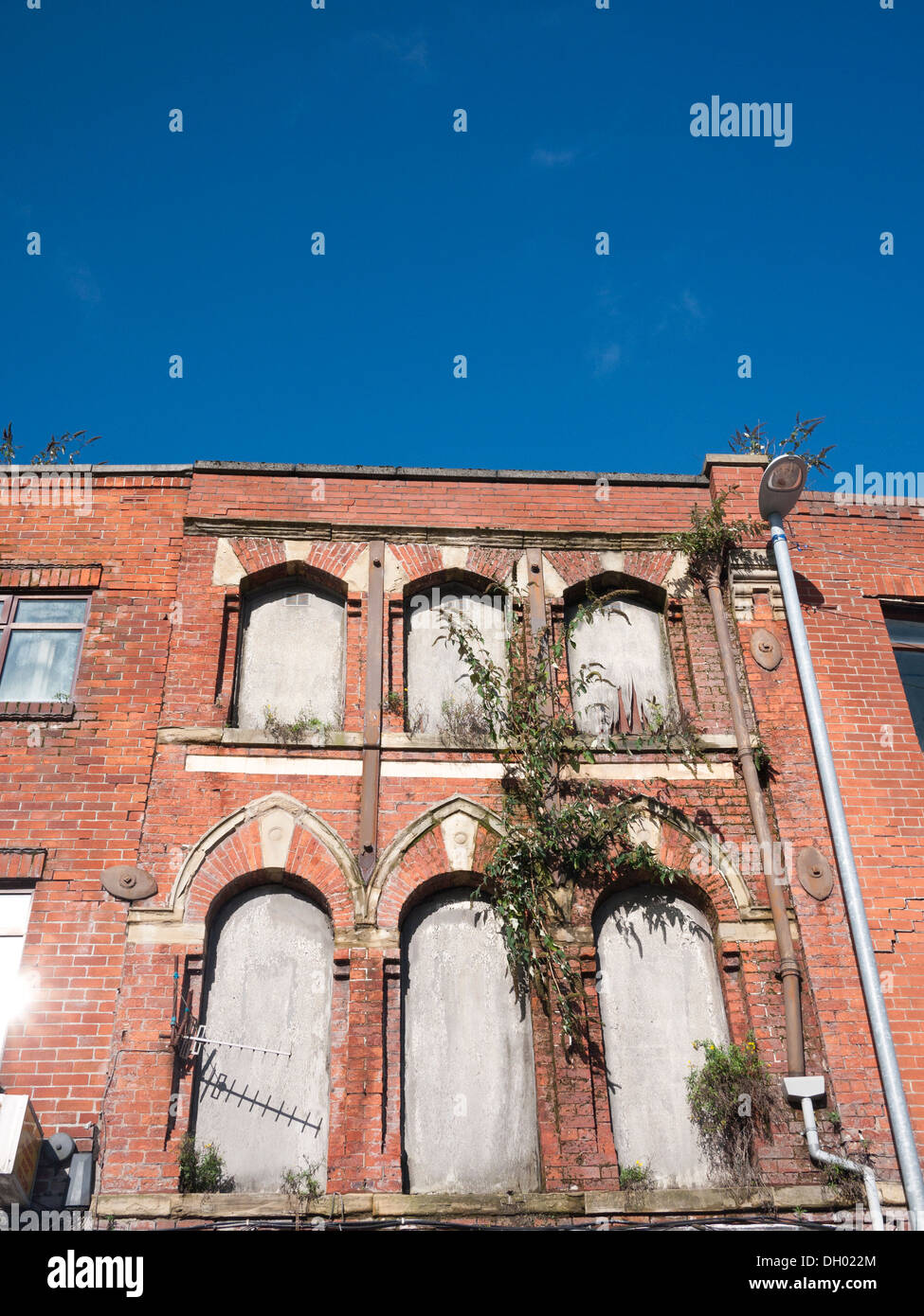 Old rundown building with plants growing in the brickwork, Oldham ...