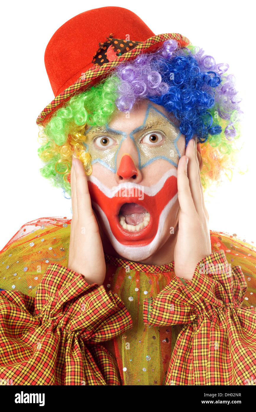 Close-up portrait of a terrified clown. Isolated on white Stock Photo ...