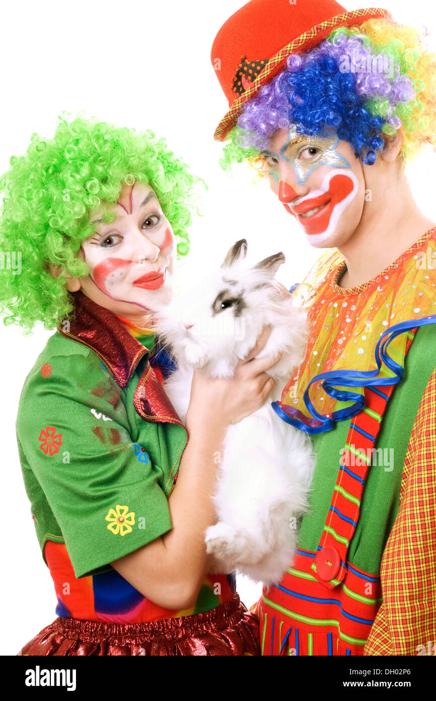 Couple of clowns with a white rabbit. Isolated Stock Photo - Alamy