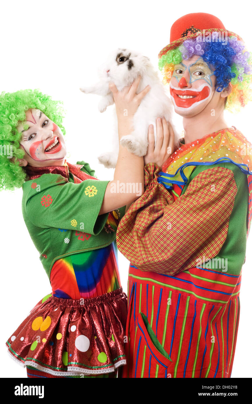 Two playful clown with a white rabbit. Isolated Stock Photo - Alamy