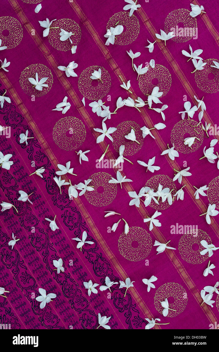 Jasmine flowers on a colourful Indian sari Stock Photo - Alamy