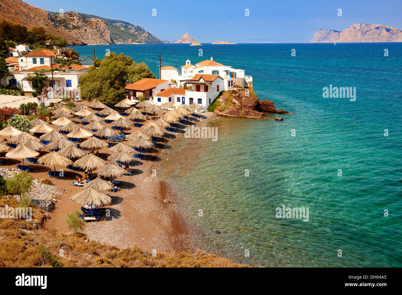 Vlychos village and beach with umbrellas, Hydra, Saronic Islands ...