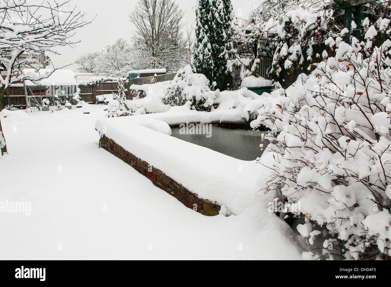 Deep snow in a garden Stock Photo - Alamy