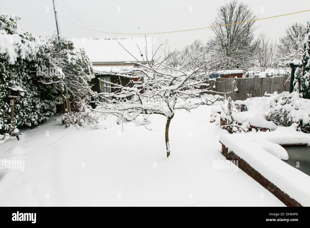 Deep snow in a garden Stock Photo - Alamy