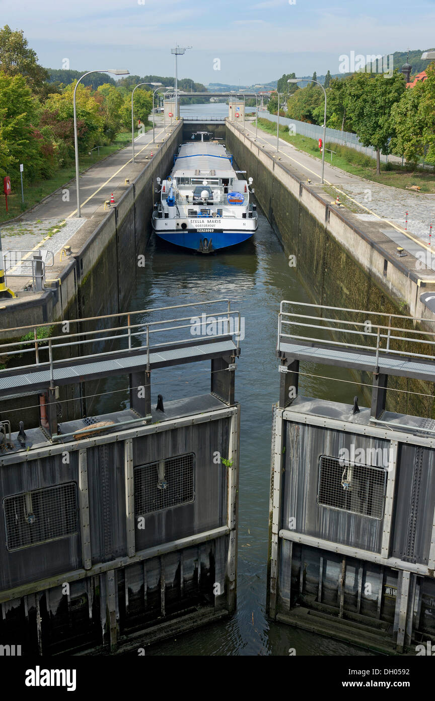 Cargo ship in a lock, sluice gates being closed for flooding, Rhine ...