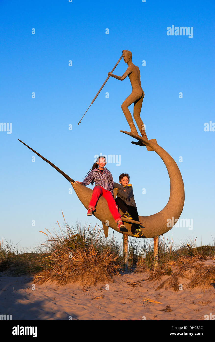 Siblings pose with Harpooner sculpture on a family vacation, Martha's ...