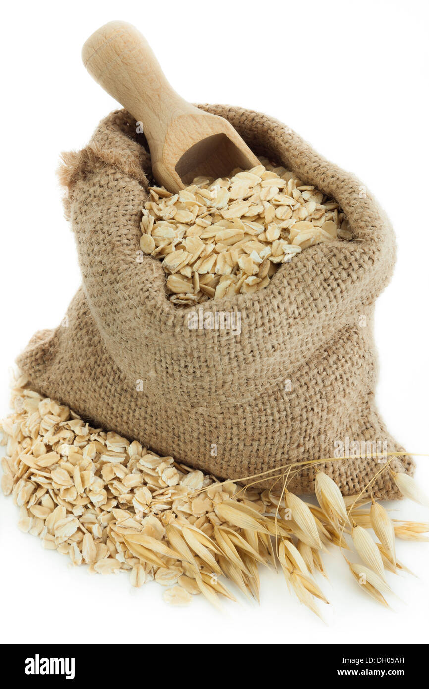 Oatmeal in small burlap sack Stock Photo - Alamy