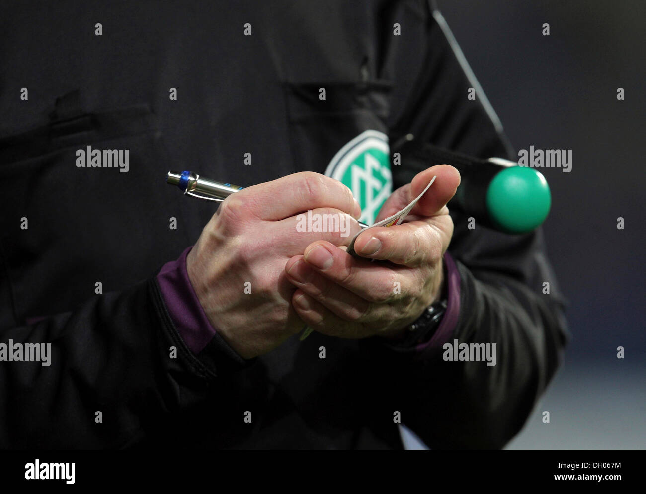 A German assistant refereee taking notes Stock Photo - Alamy